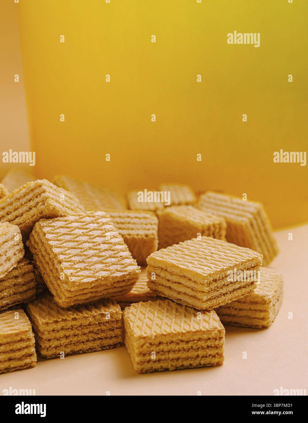 Food, A collection of crispy, square wafers lies scattered against a ...