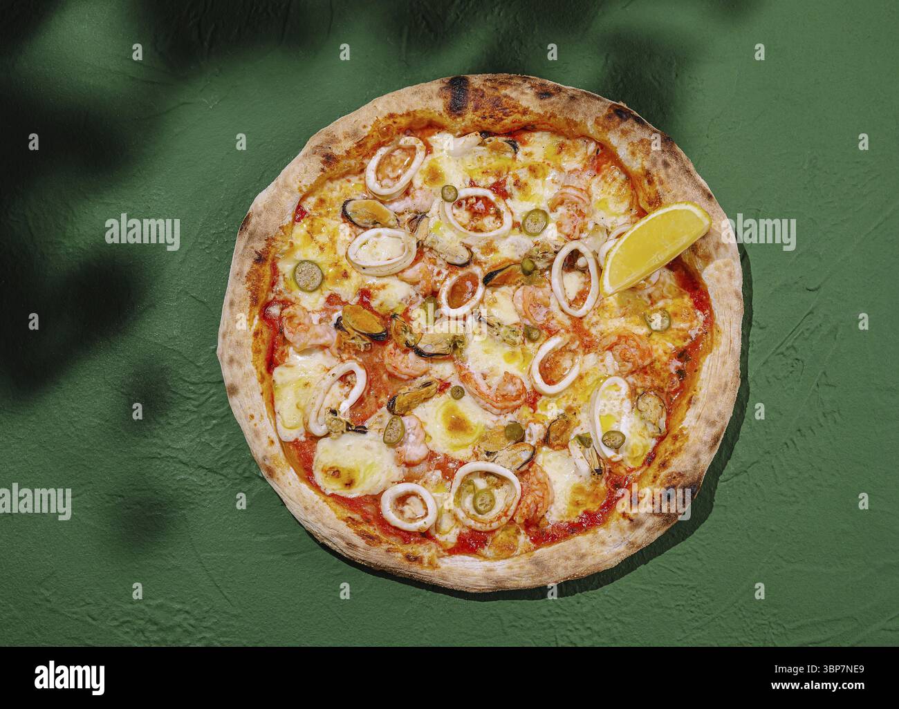 Food, A fresh seafood pizza features calamari rings, green olives, and ...