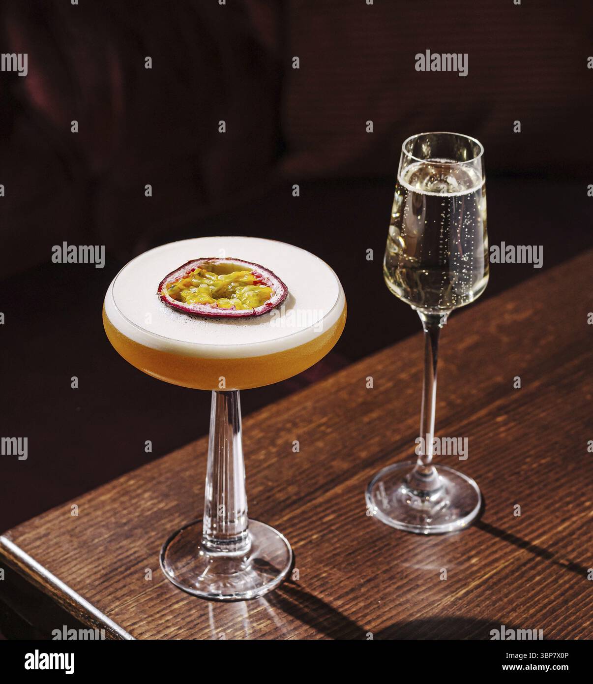 Food, A vibrant cocktail garnished with passion fruit sits elegantly in ...