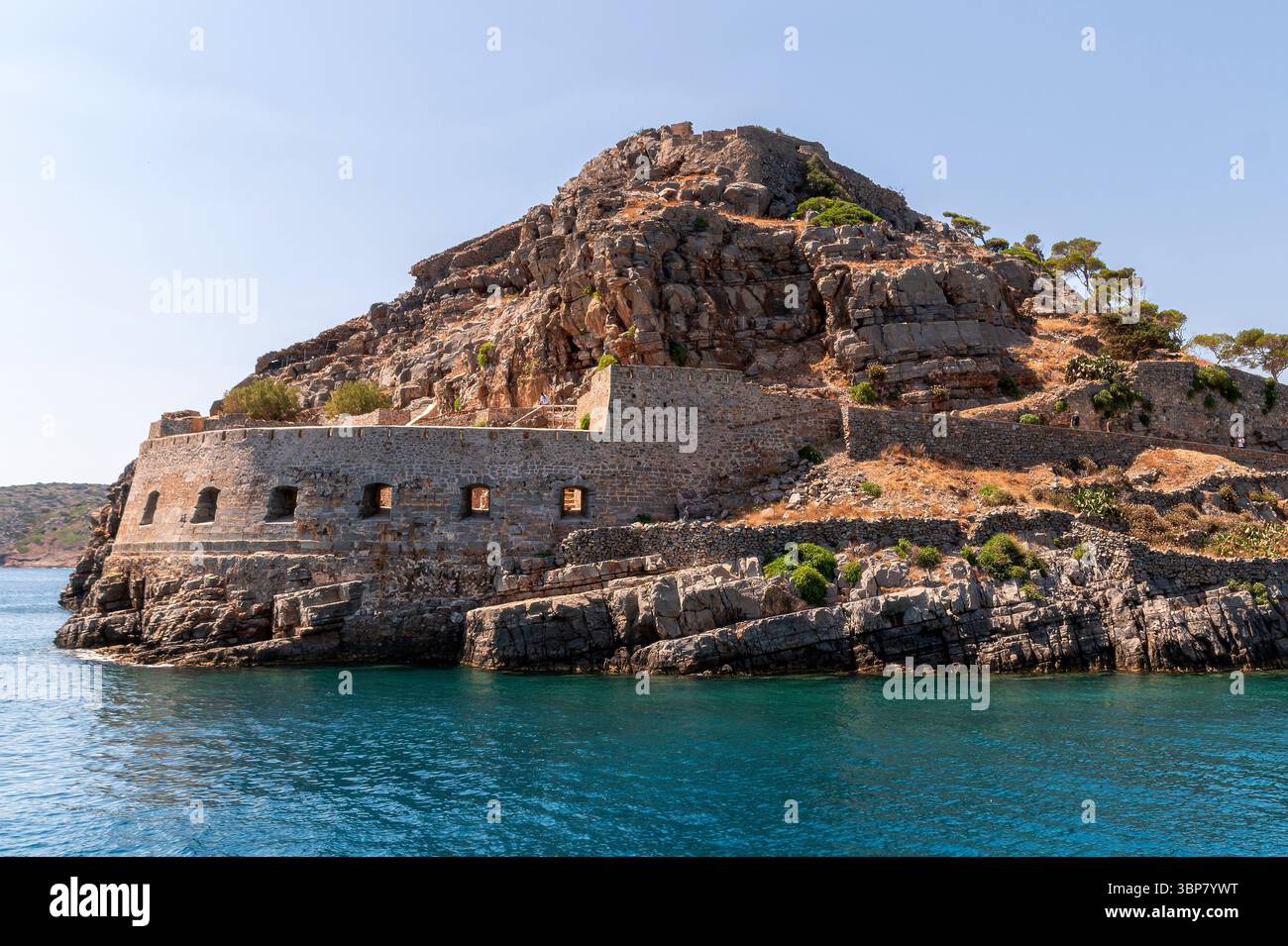 Explore Spinalonga Island, a historic leper colony, surrounded by clear ...