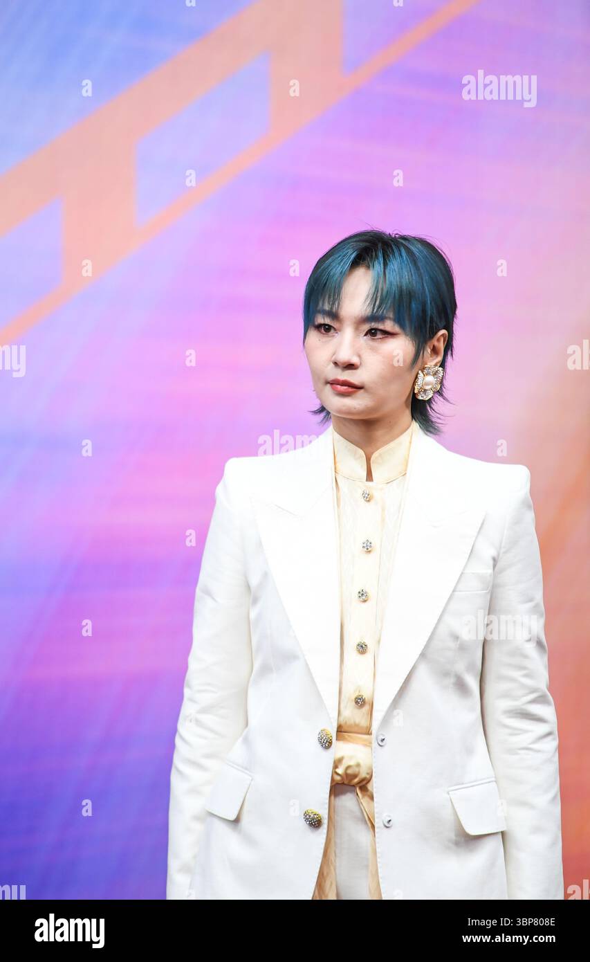 Chongqing. 6th July, 2025. Singer Zhou Bichang poses on the red carpet ...