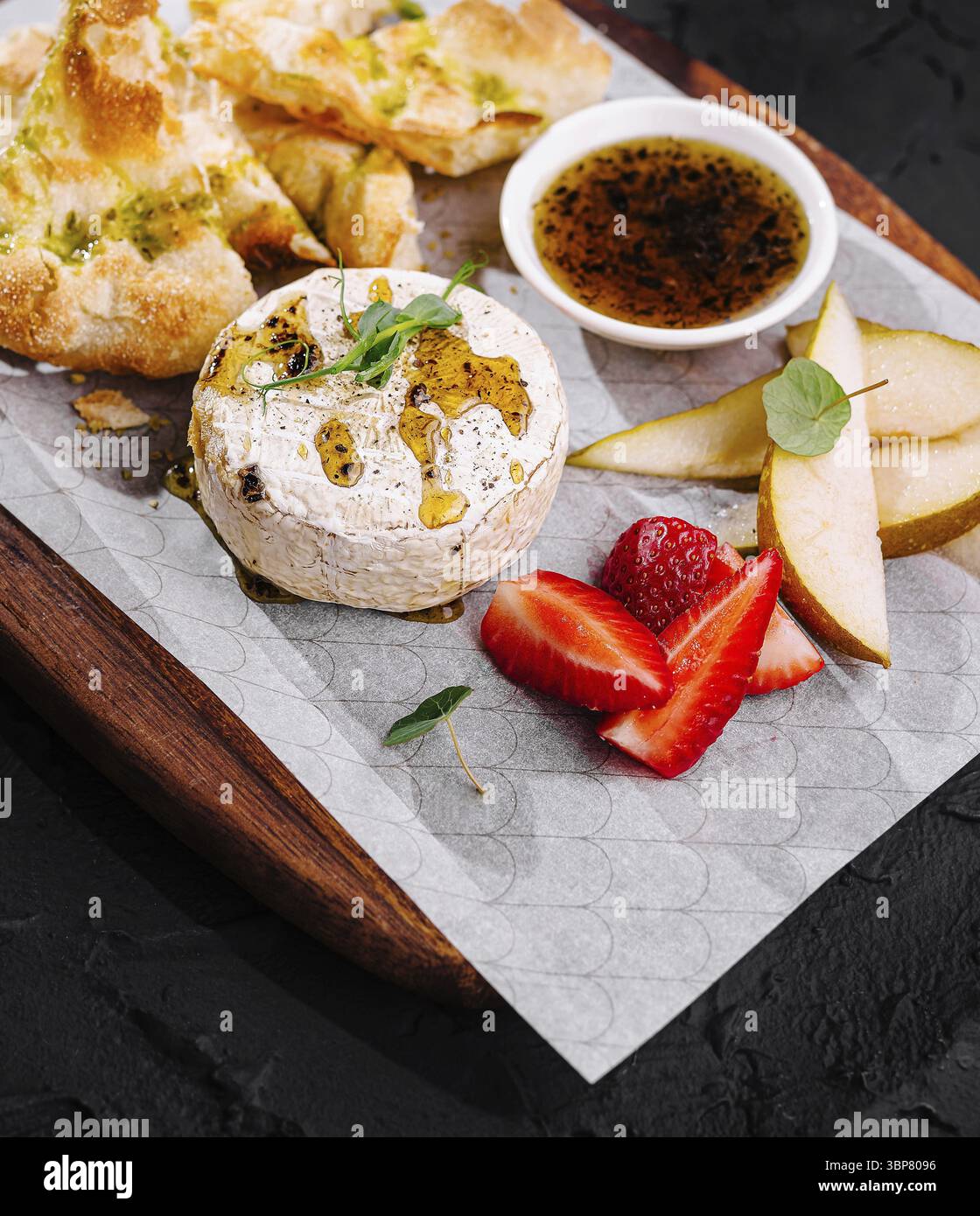 Food, Oven-baked brie cheese with a side of fresh pear, strawberry, and ...