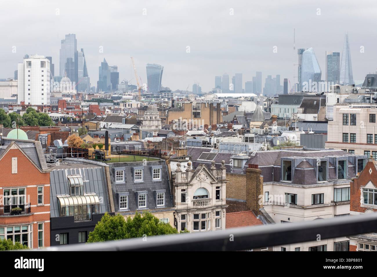 The iconic skyline of the capital city of the UK , London viewed from a roof top in Soho Stock ...