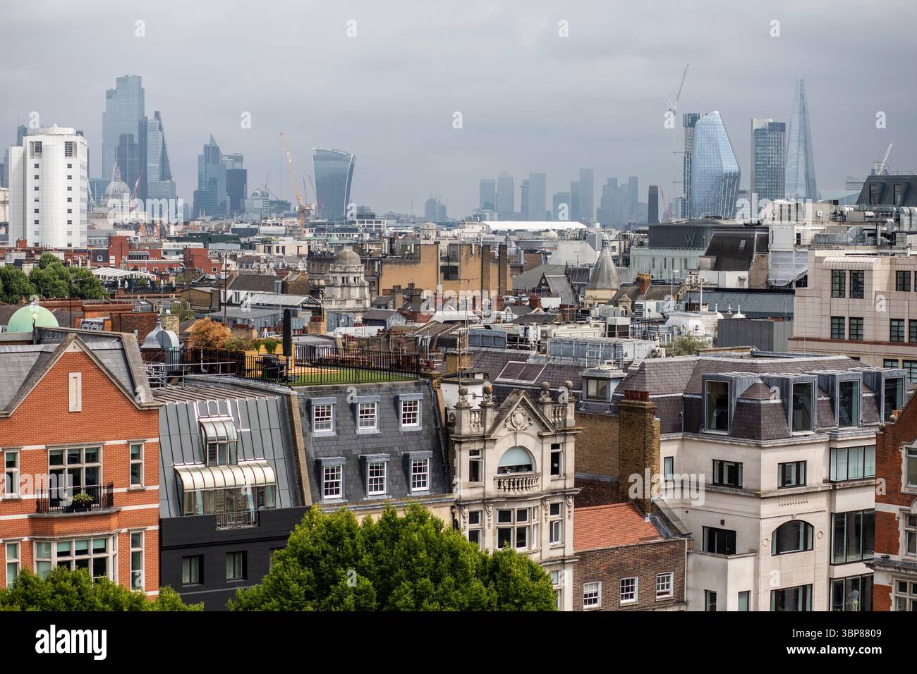 The iconic skyline of the capital city of the UK , London viewed from a roof top in Soho Stock ...