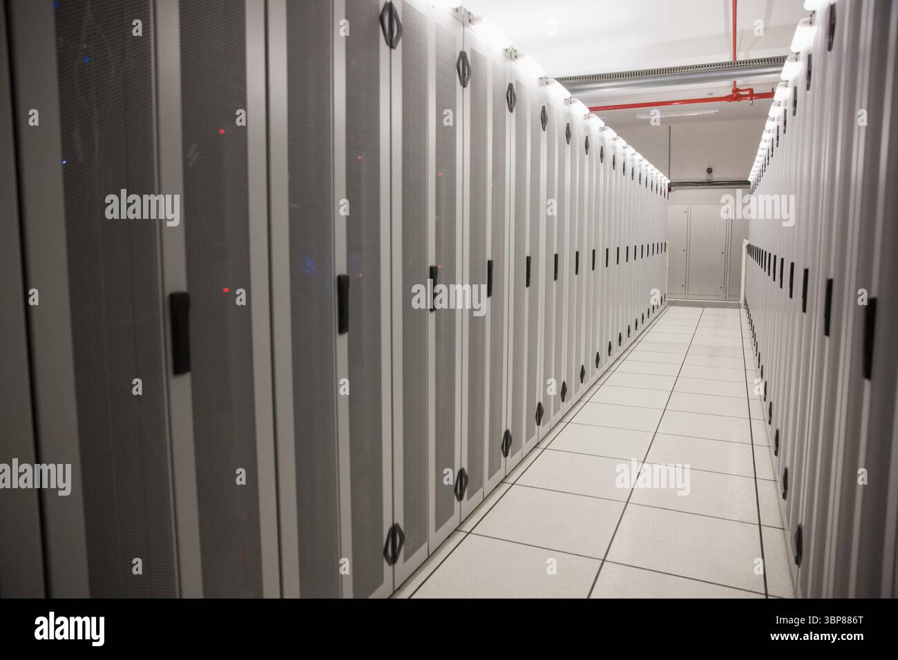 Server cabinets are receding into server room hallway in 3D render with ...