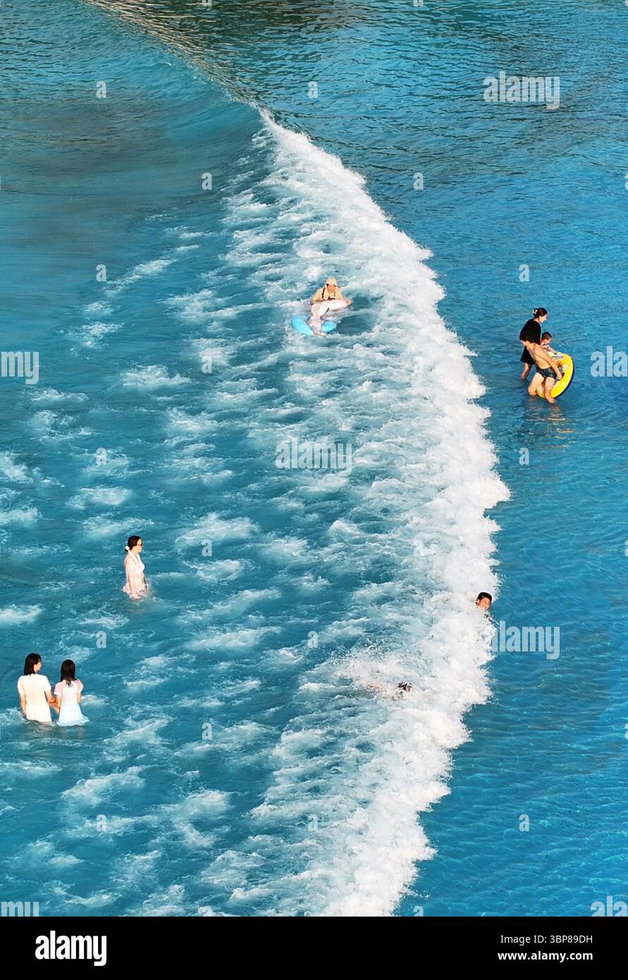 Aerial photo shows people playing at a water park in Yangzhou City ...