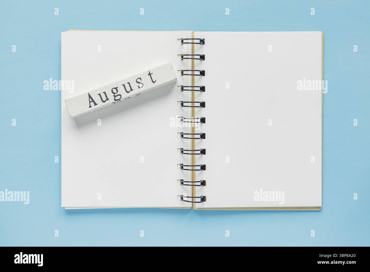 Clean spiral note book for notes and messages and august wooden ...