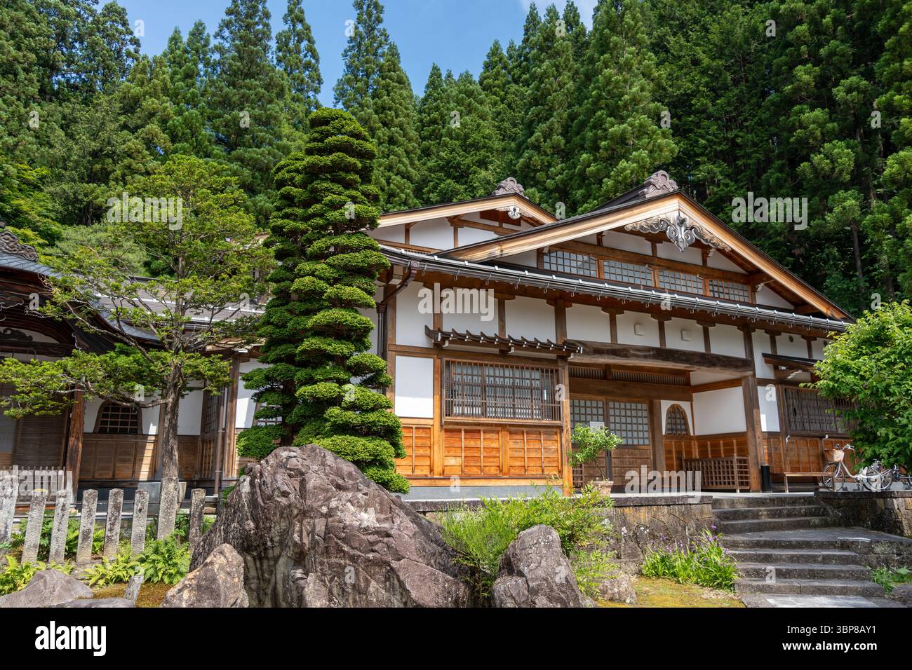 Traditional wooden structures and manicured gardens surround the main ...