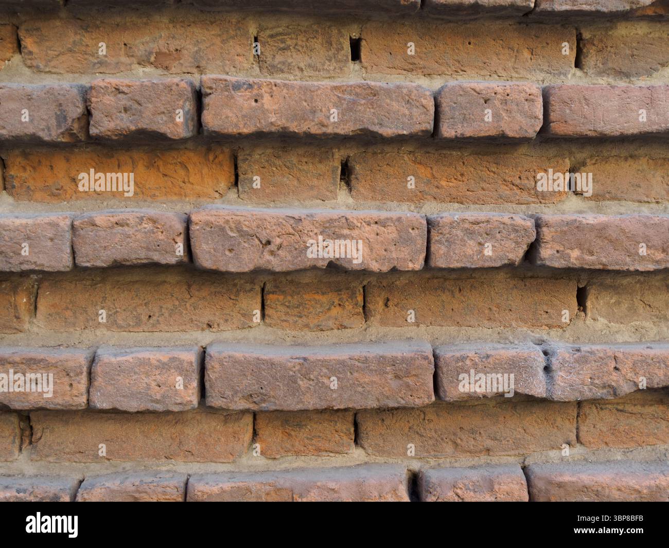 Cremona, Italy June 28th 2025 Weathered convex brick surface revealing ...