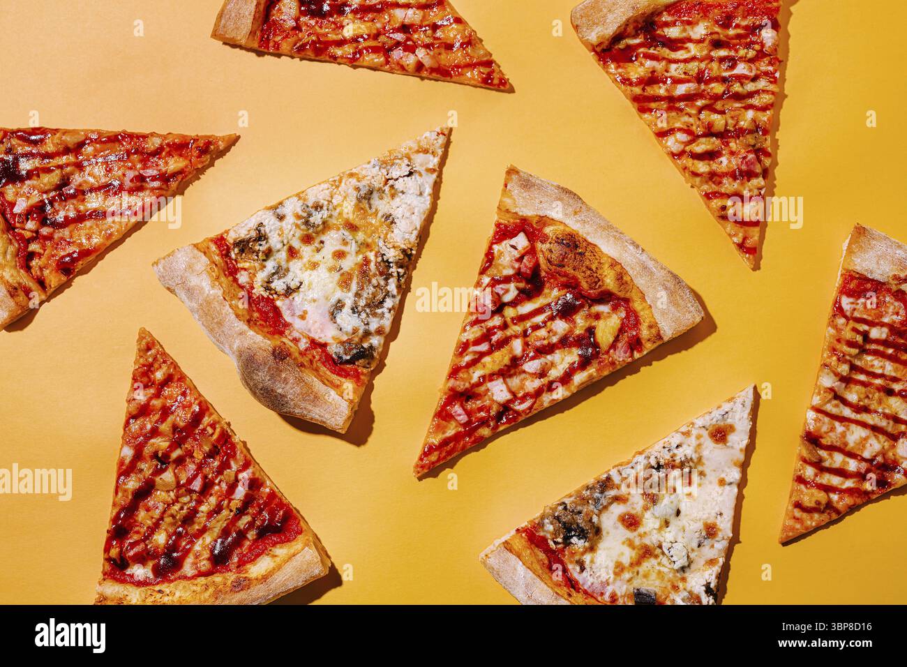 Food, Various flavorful pizza slices are artfully arranged on a bright ...