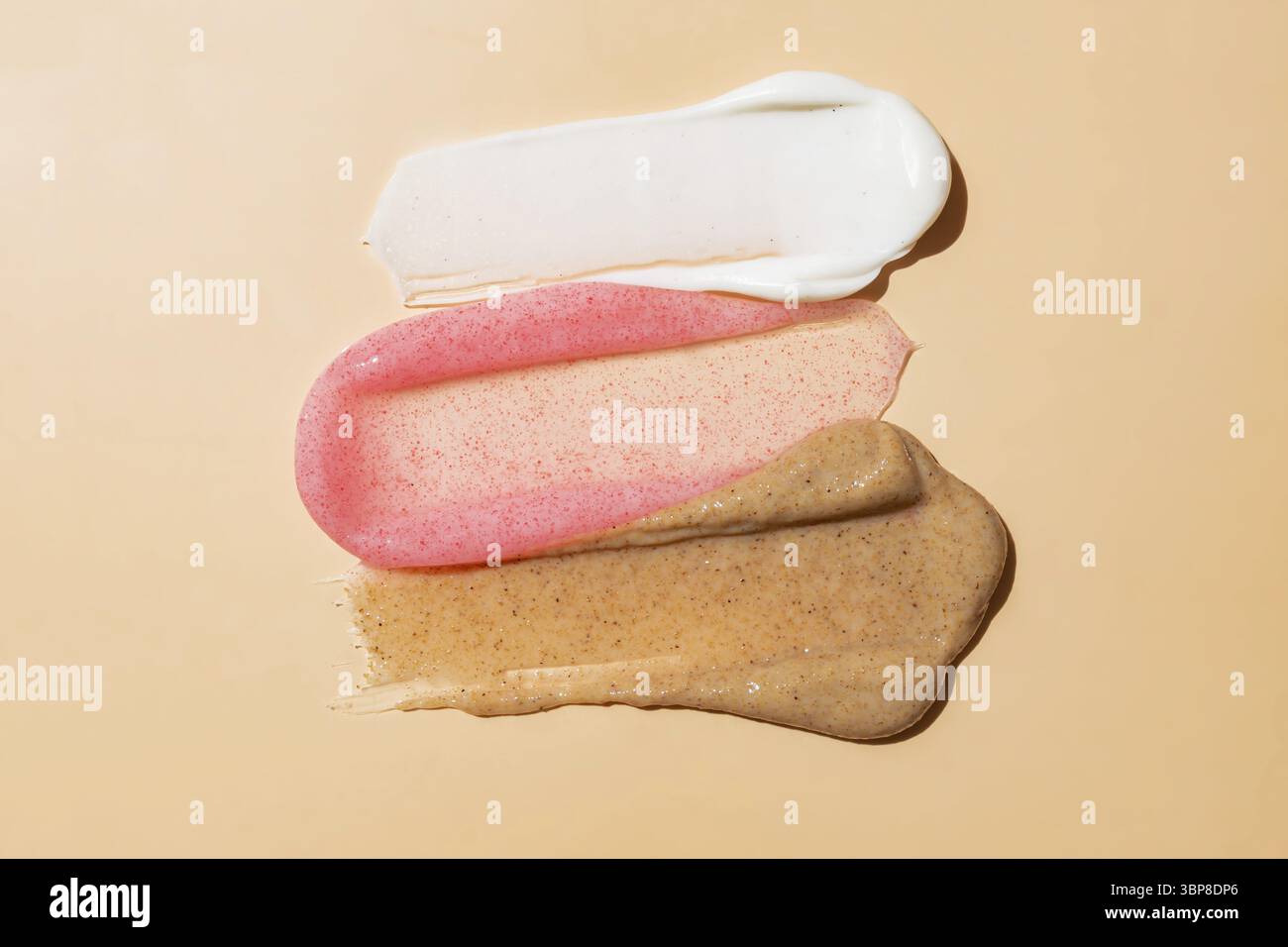Three types of face scrub on beige background. Face body skin peeling ...
