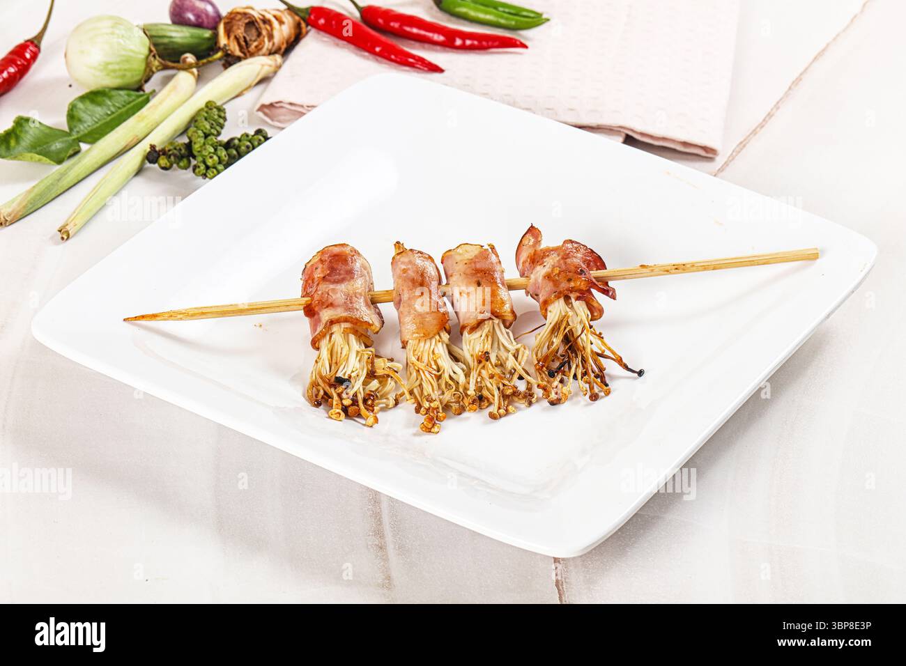 Thai Street foof satay with bacon and mushroom enoki skewer Stock Photo ...