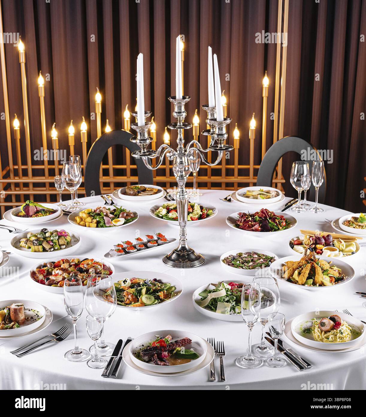 Food, Luxurious dining scene with a variety of meals and lit candles ...