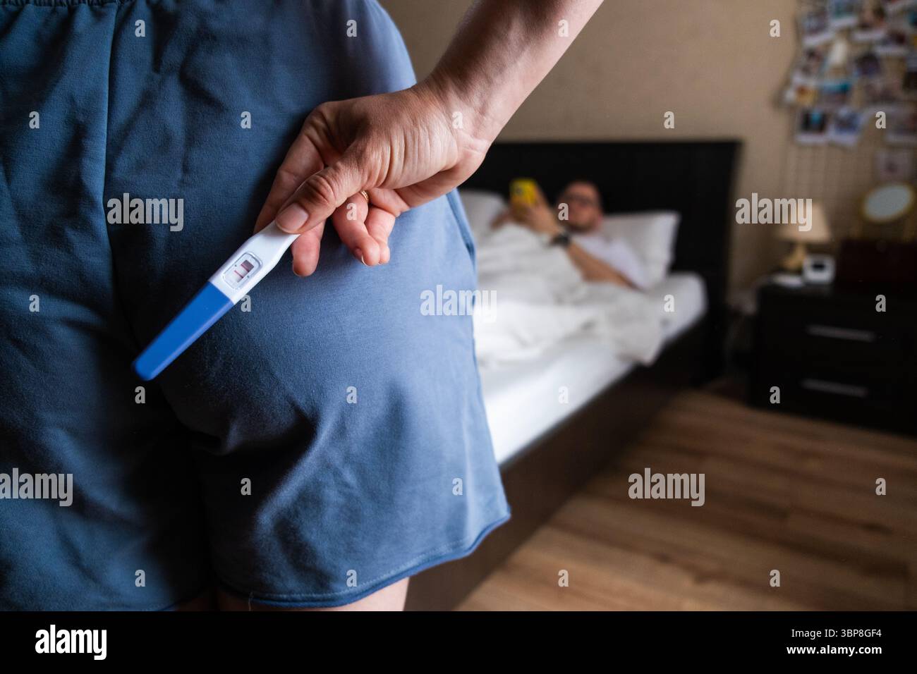 Positive Pregnancy Test Hidden Behind Back Stock Photo - Alamy