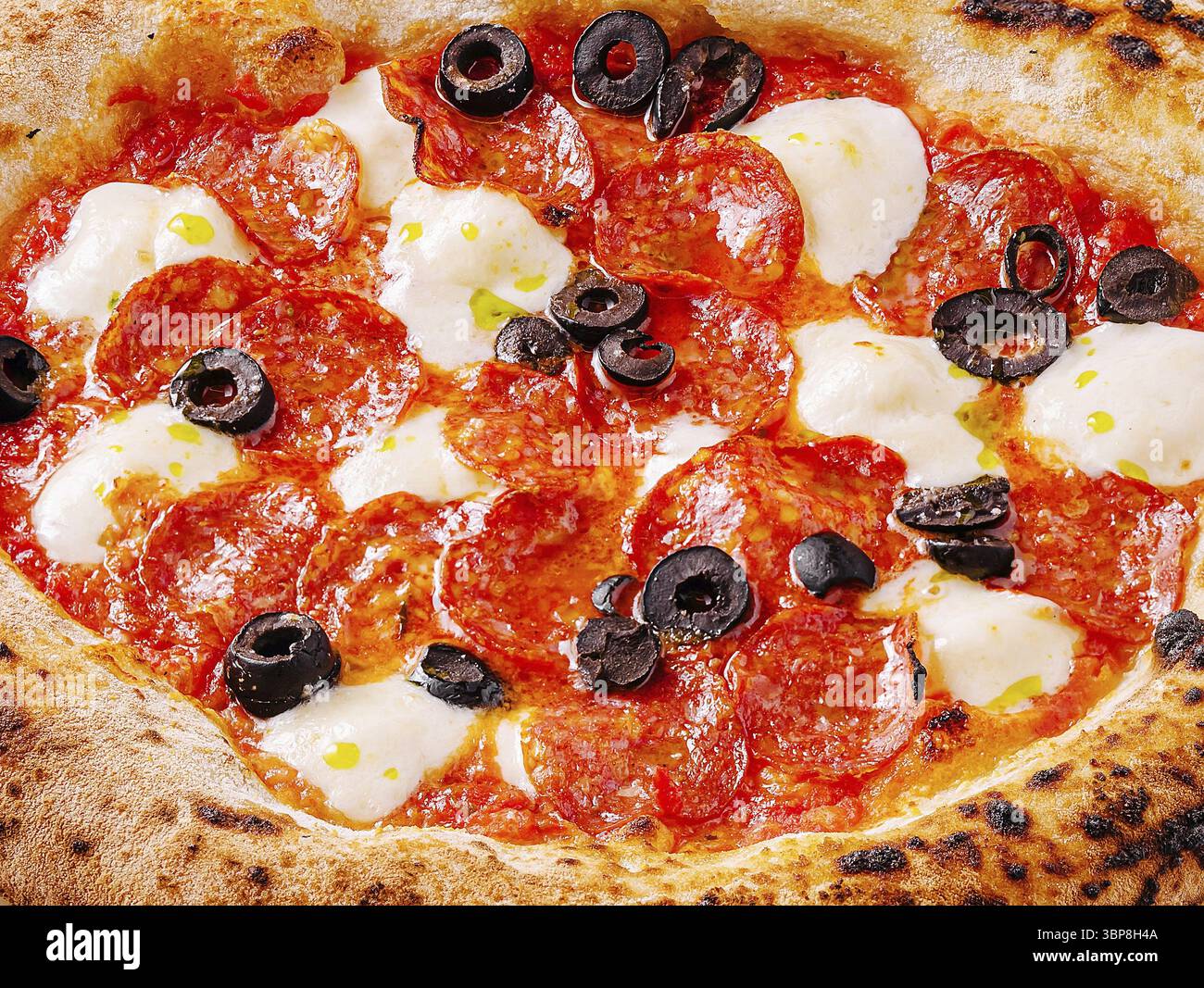Food, Freshly made pepperoni pizza topped with slices of black olives ...