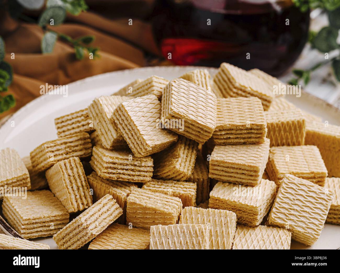Food, A large pile of crunchy wafers sits on a plate, showcasing their ...