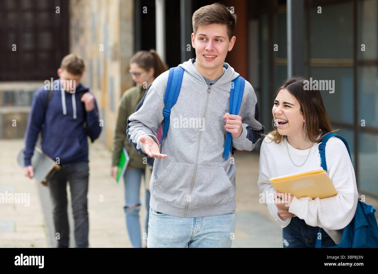 Teenage students talking outside after lessons Stock Photo - Alamy