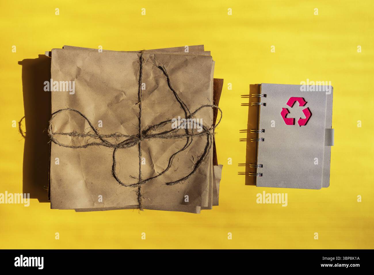 Concept of waste paper recycling process. Note book made of reusable ...