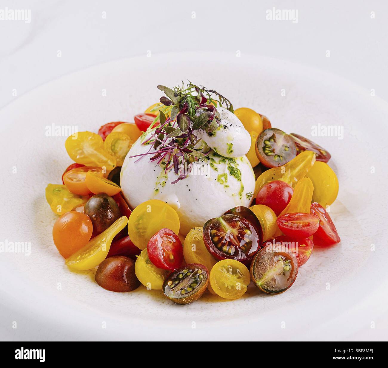 Food, Fresh burrata with colorful cherry tomatoes and herbs, presented ...