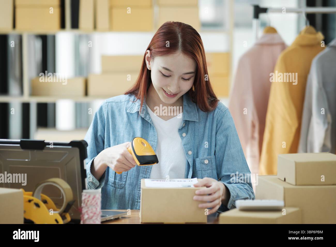 Scanning barcode on shipping label with handheld scanner. Order ...