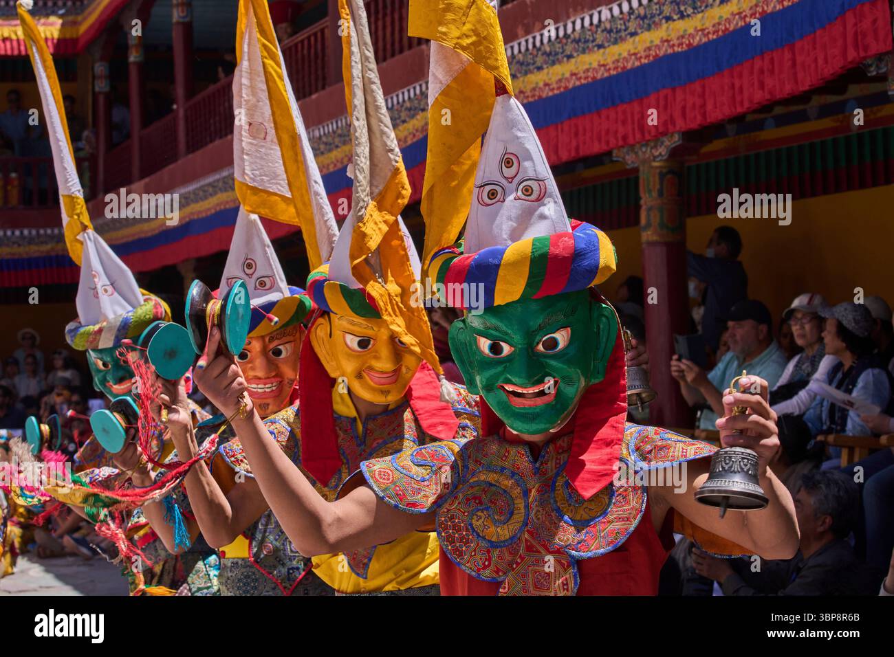 Buddhist monks in ceremonial costume perform a ritual dance during the ...