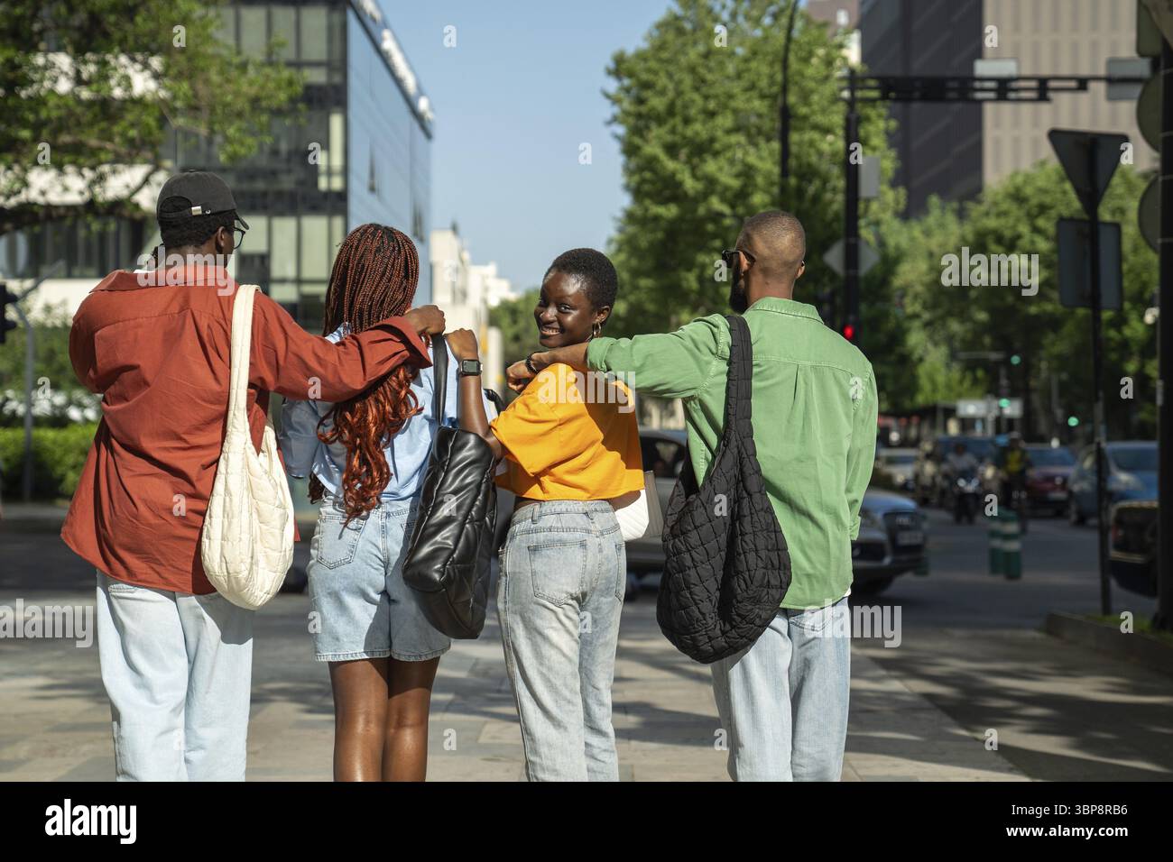 Group of pleased african american stylish people hangout at city street ...