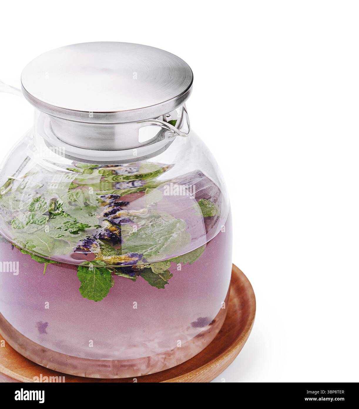 Food, A glass pitcher filled with a vibrant herbal infusion, showcasing ...