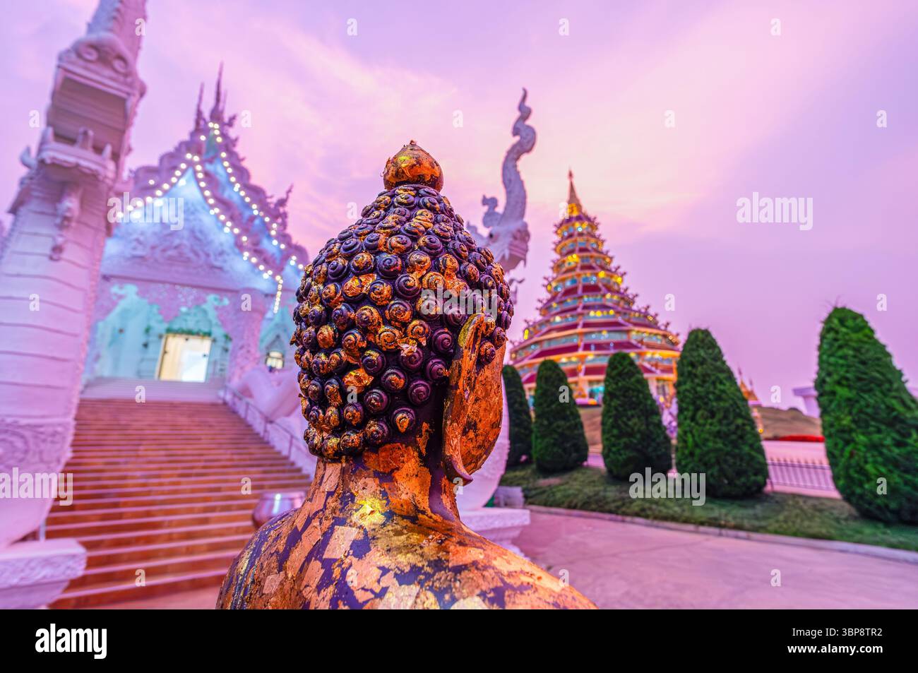 The golden head of Buddha statue at the foot of Naga staircases of ...