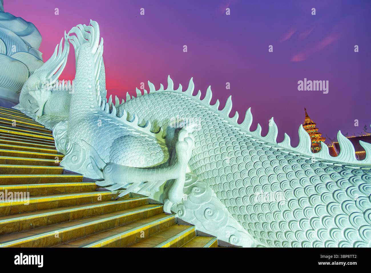 White serpentine Naga stairways rise toward the shrine at Wat Huai Pla ...