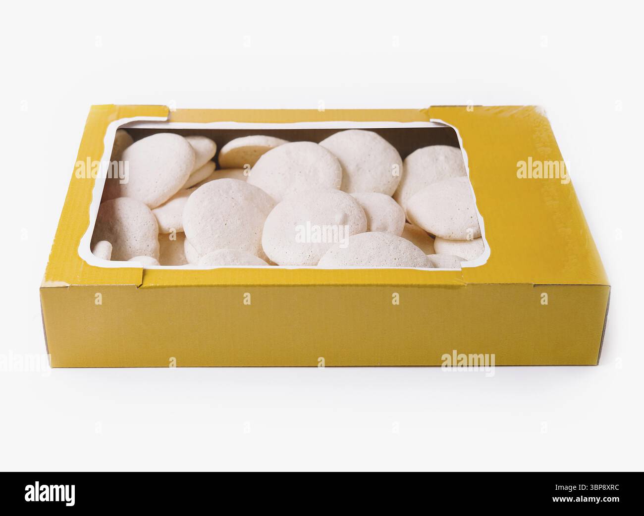 Food, Yellow cardboard box full of meringue cookies is laying on a ...
