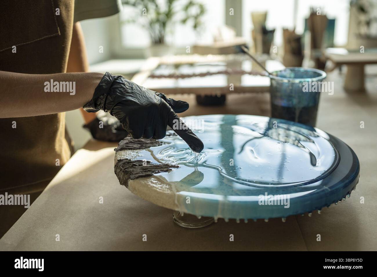 Woman wearing protective gloves painting hi-res stock photography and ...