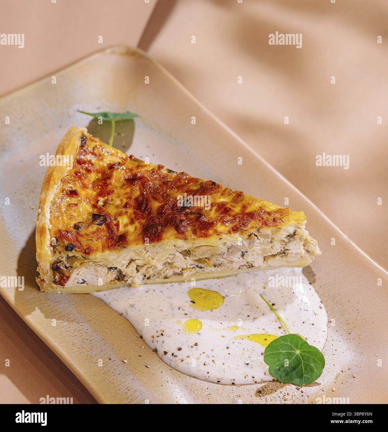 Food, Stylish presentation of a classic quiche slice with sauce and ...
