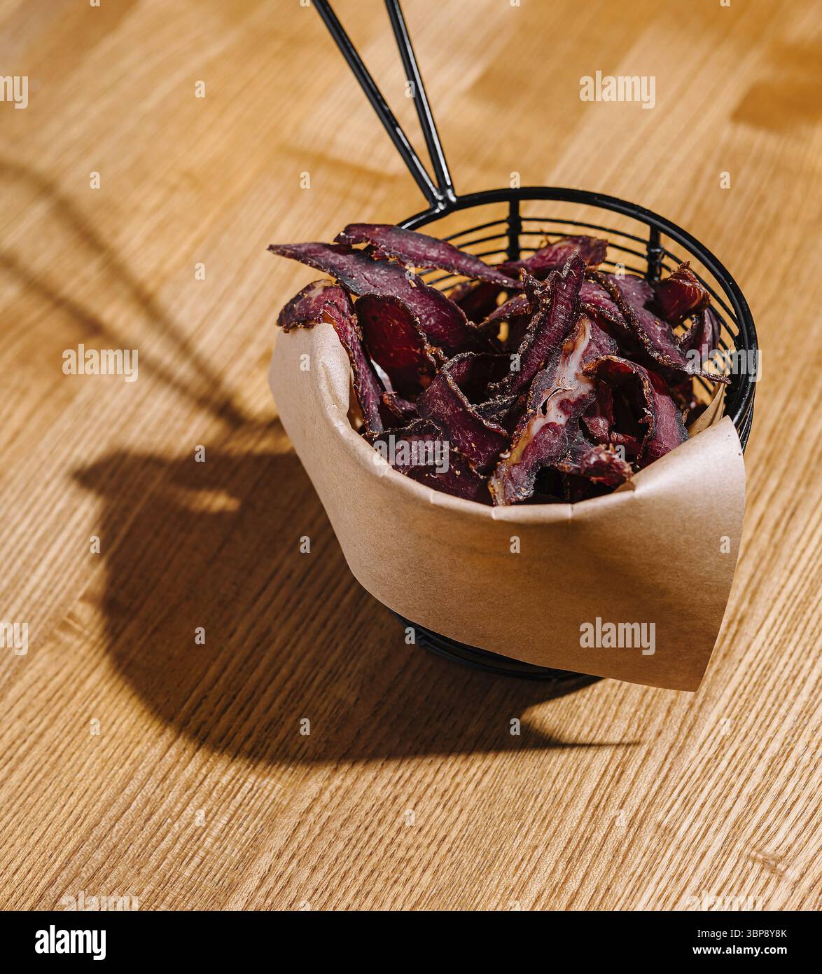 Food, Cone of gourmet beef chips served in a stylish wire basket ...