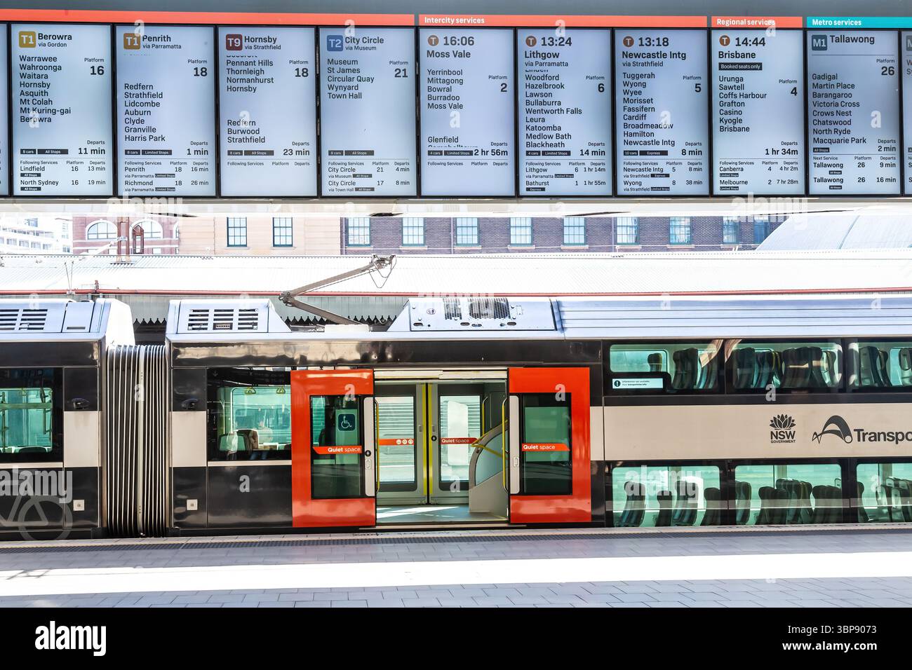 A mainline train at Central Station, Sydney, with destination boards ...
