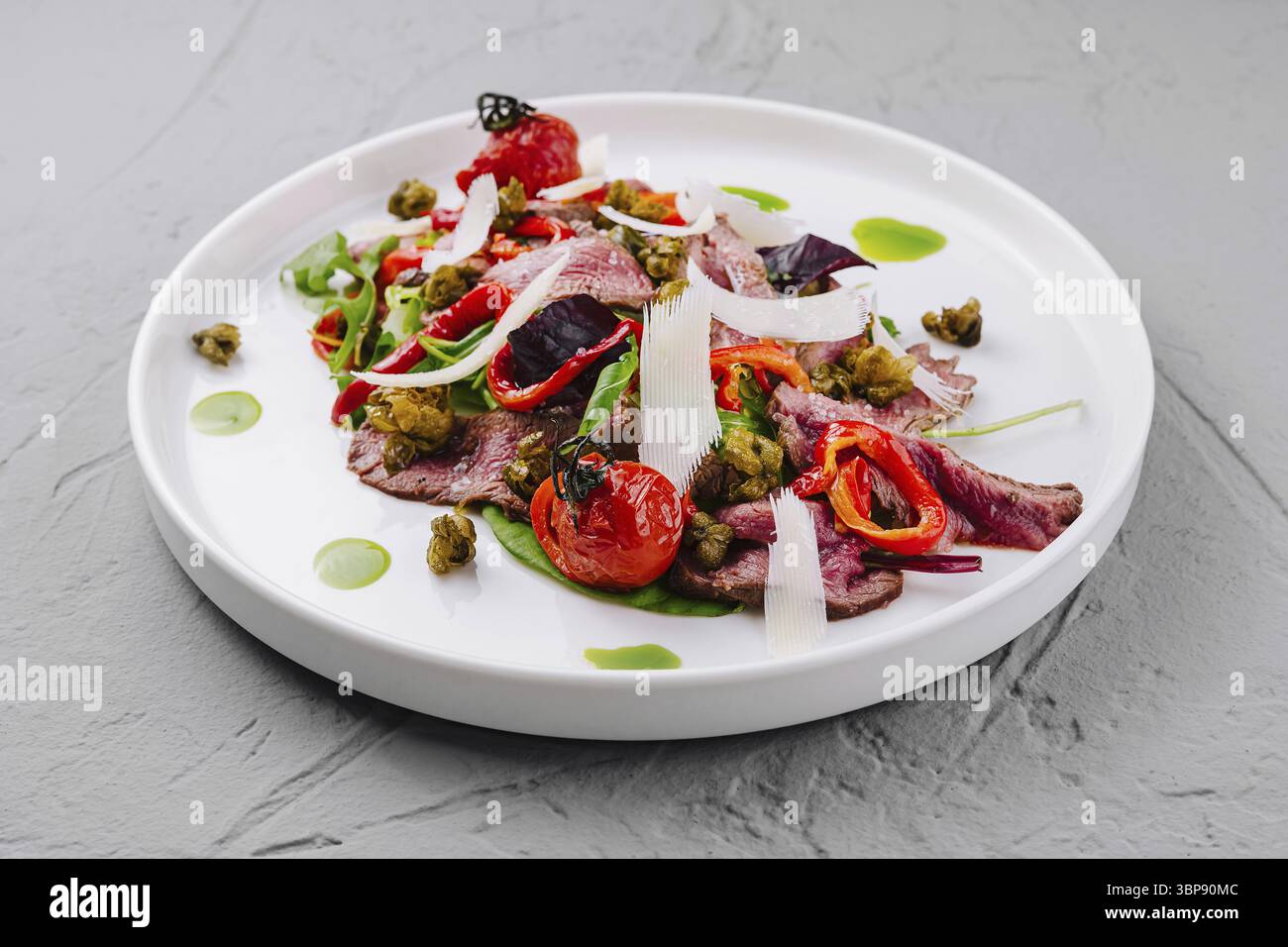 Food, Elegant beef carpaccio with veggies, capers, and sauce, served on ...