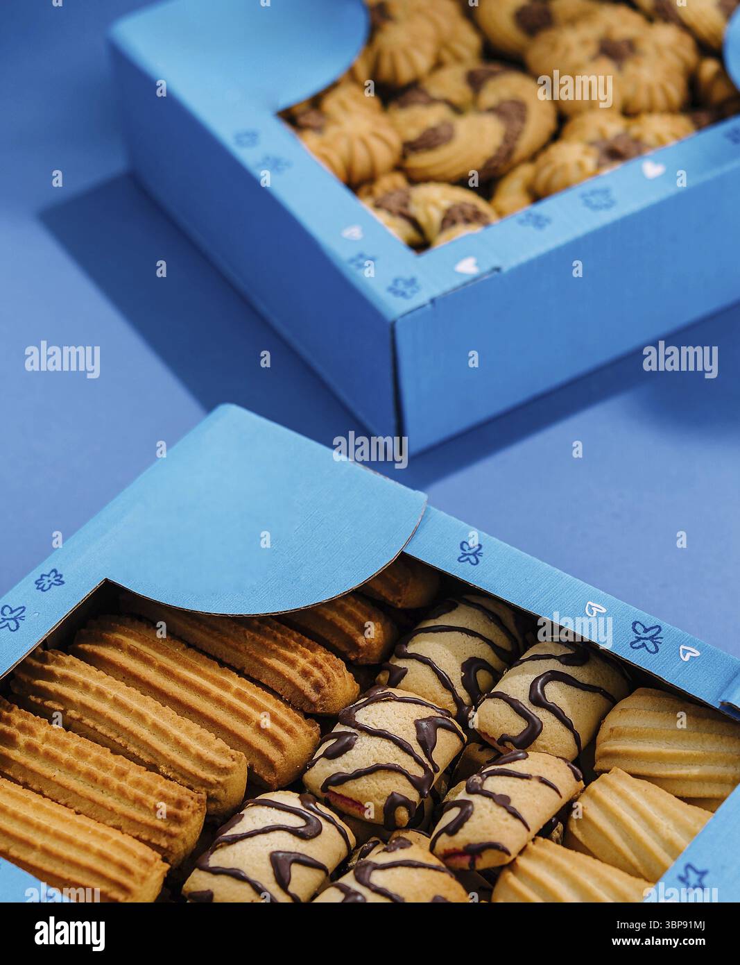 Food, Crumbly cookies in blue boxes Stock Photo - Alamy