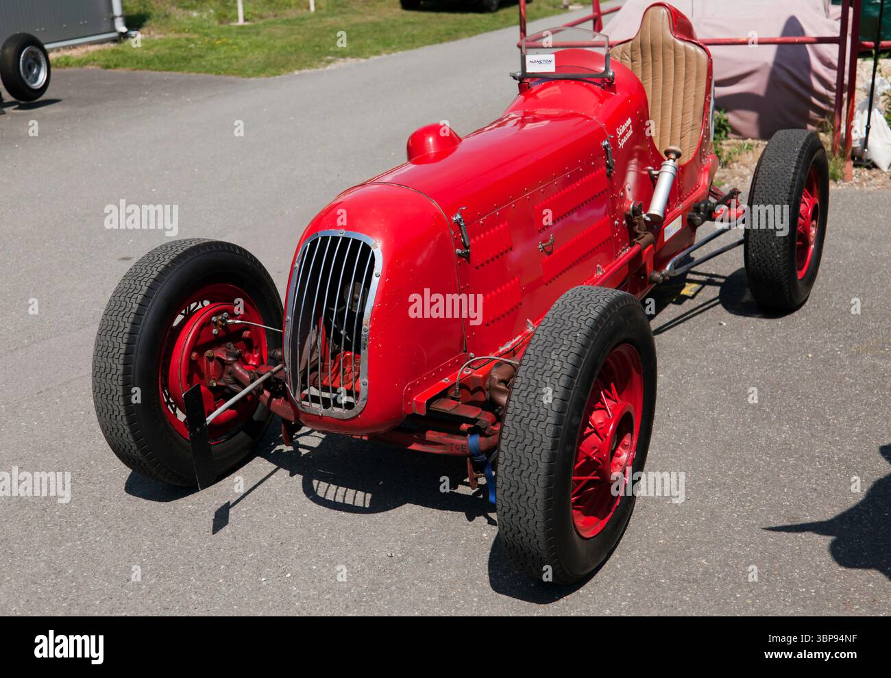 Three-quarters Front View of Dave Gibbons driving his Red, 1929 ...