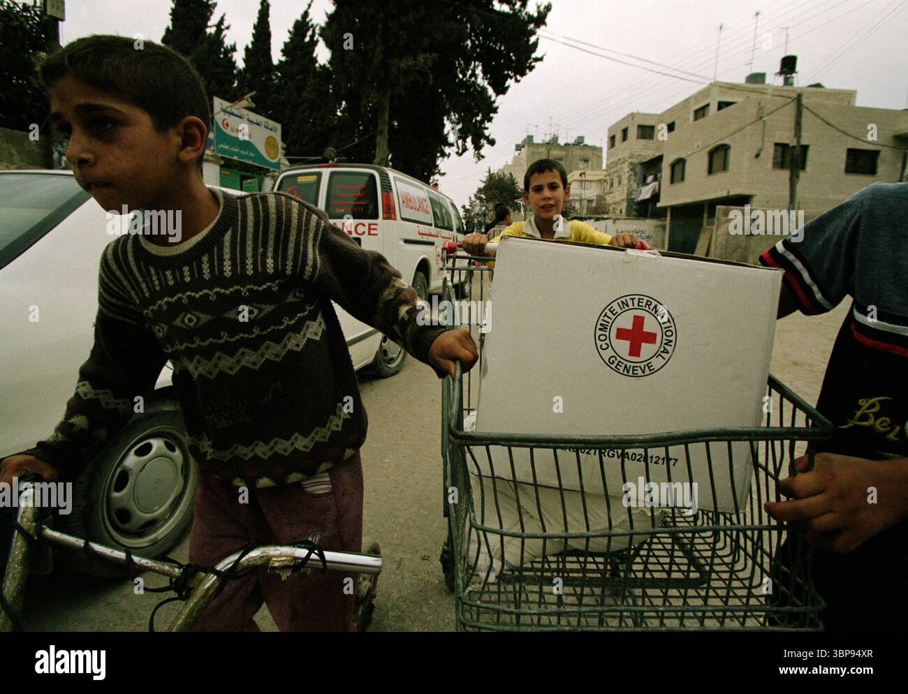Nablus food distribution delivery boys Stock Photo - Alamy