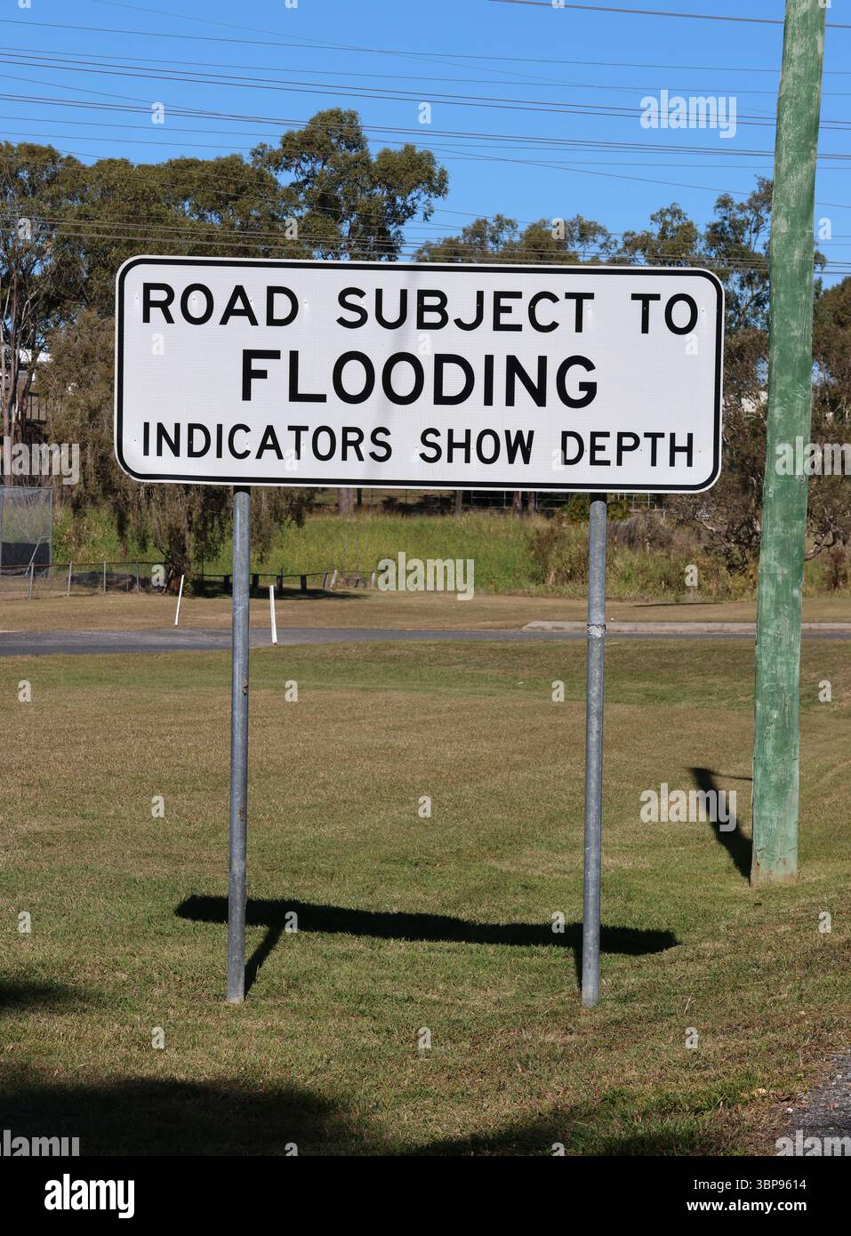 Road Subject To Flooding sign in a grassy environment Stock Photo - Alamy