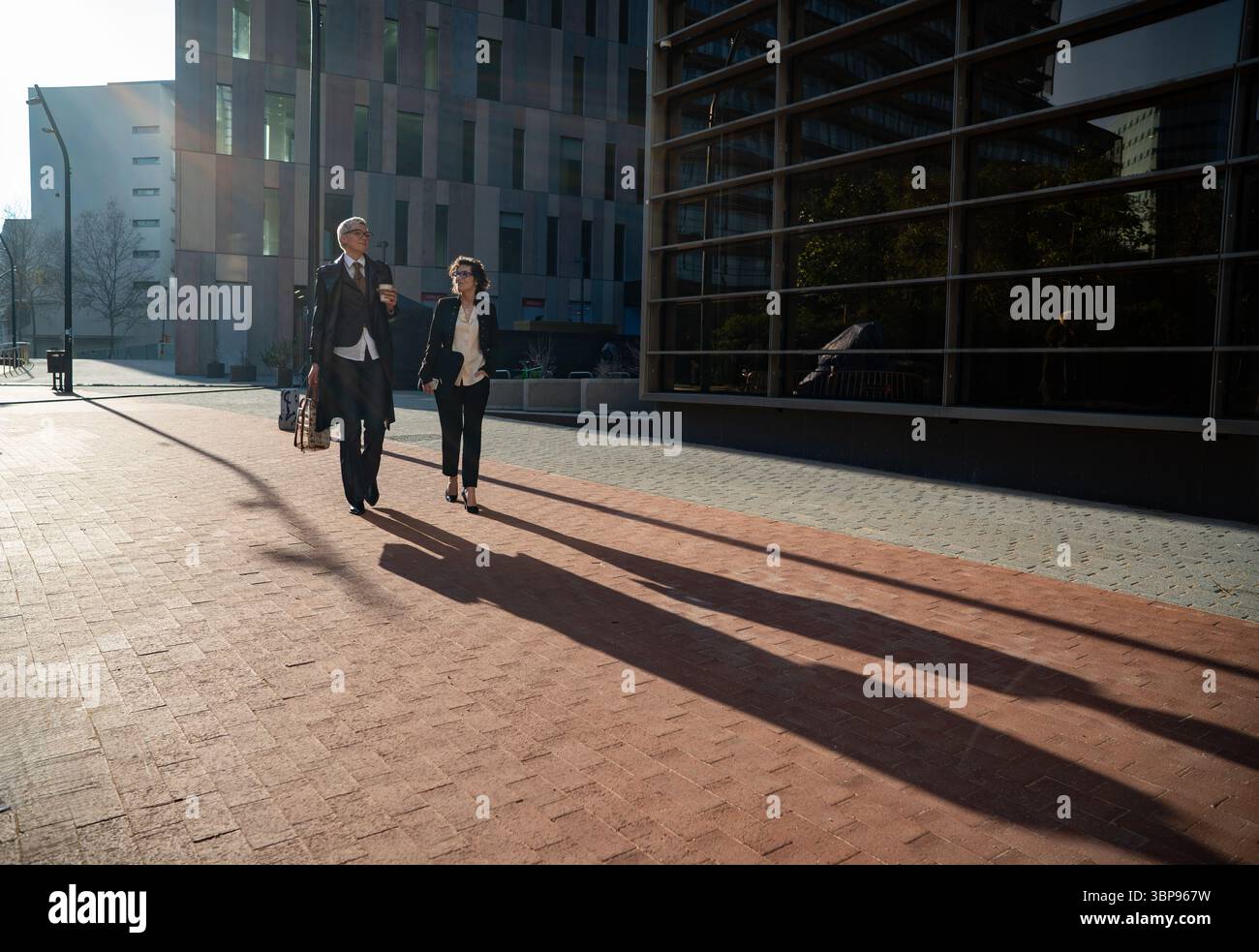 Walking man in suit talking hi-res stock photography and images - Alamy