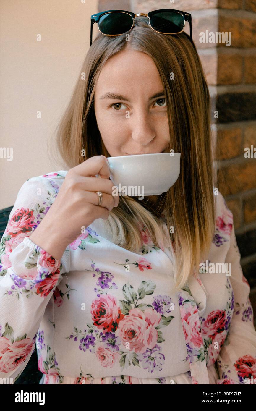 Peaceful woman drinking tea hi-res stock photography and images - Alamy