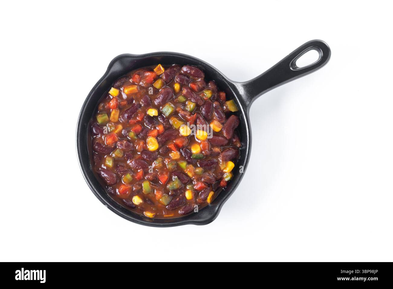 Mexican chilli beans with vegetables in iron pan isolated on white ...