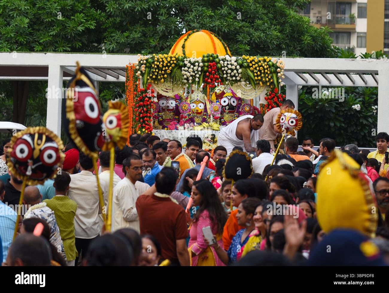 GURUGRAM, INDIA - JULY 6: Devotees pull chariot of Lord Jagannath, Lord ...