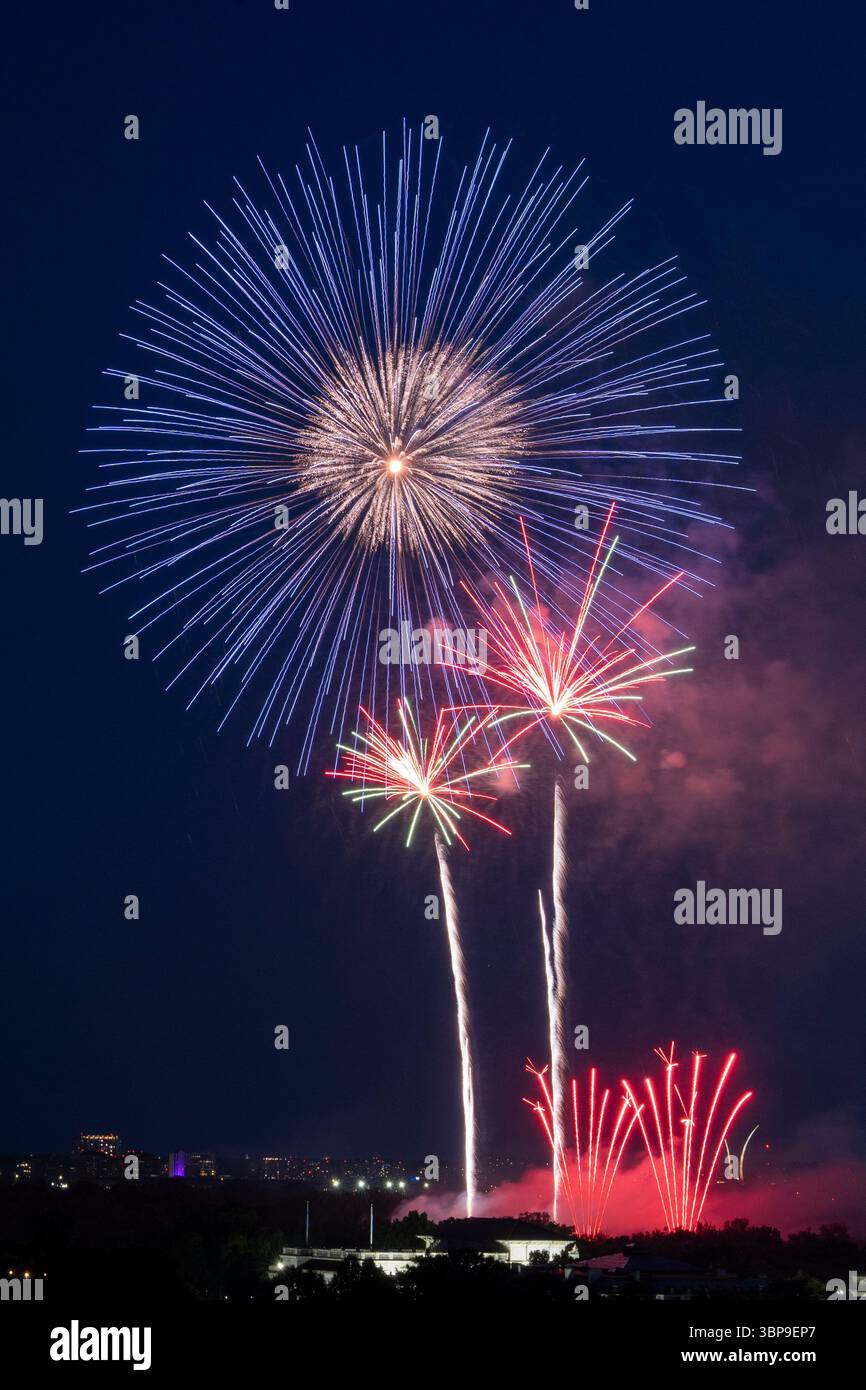 Fireworks explode near the United States Air Force Memorial during a Fourth of July celebration ...