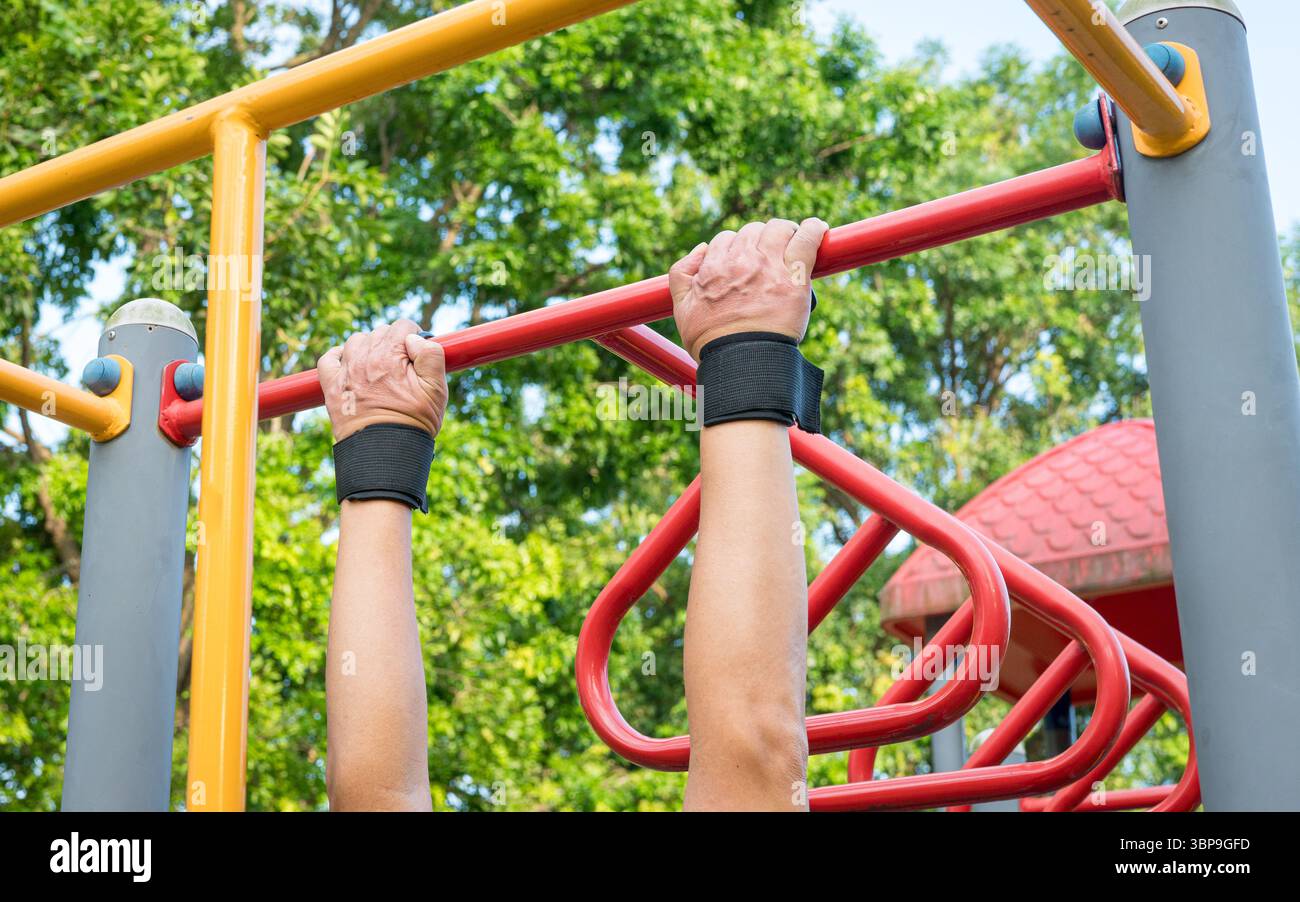 Man doing pull ups workout on the steel bar using a wrist grip Stock ...