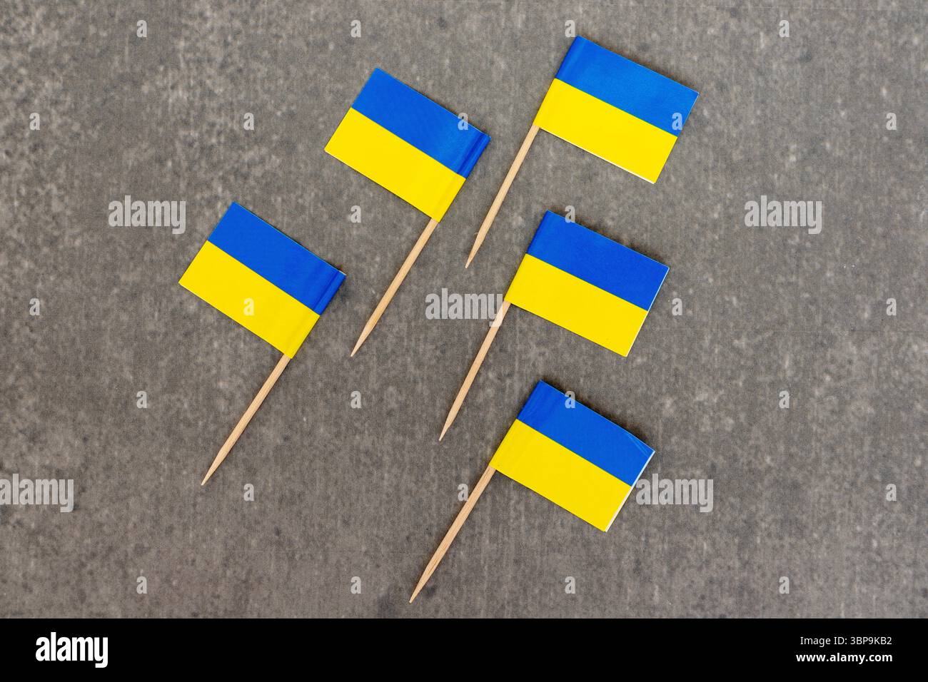 Five Ukraine Mini Flags Arranged on Gray Background Stock Photo - Alamy