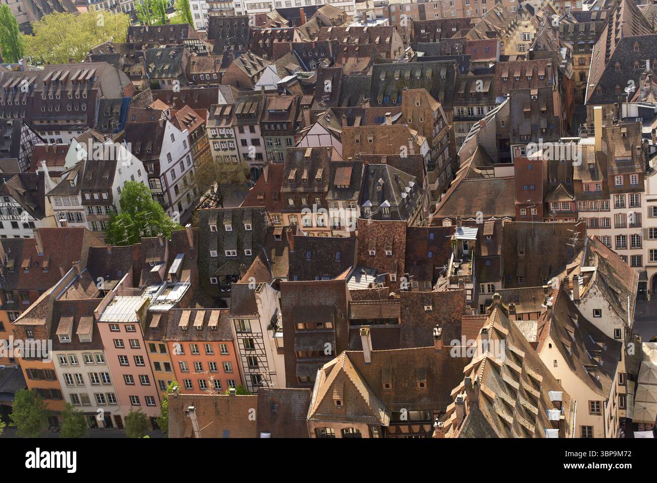 Aerial view of densely packed European rooftops with a mix of ...