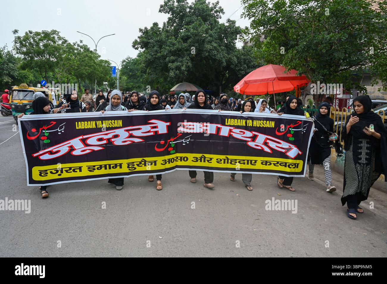 NOIDA, INDIA - JULY 6: Shiite Muslim devotees participate in a mourning ...