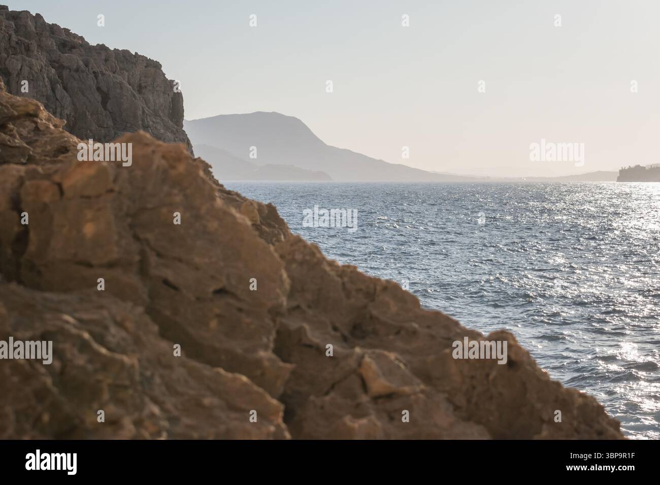 View of the blue sea from a cliff. Greek landscape in Crete Stock Photo ...