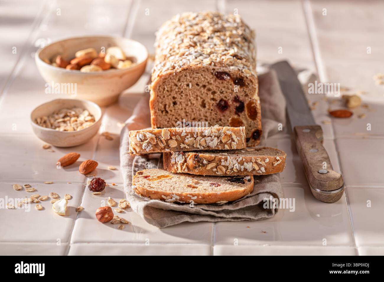 Healthy delicacies bread baked in home bakery. Bread with nuts, raisins ...